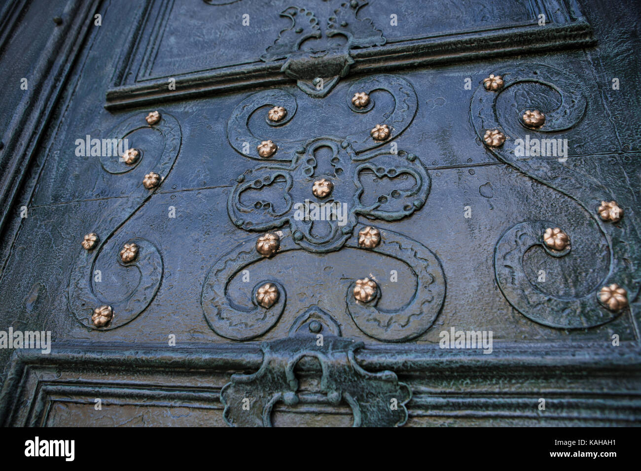 old metal forged doors green color Stock Photo - Alamy