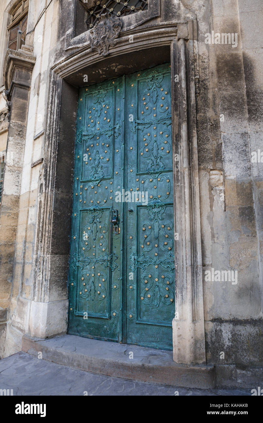 the old metal forged doors green color Stock Photo - Alamy
