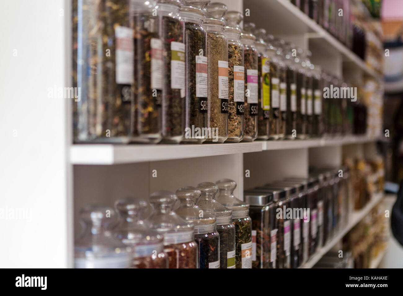 many glass jars with tea on store shelves Stock Photo - Alamy
