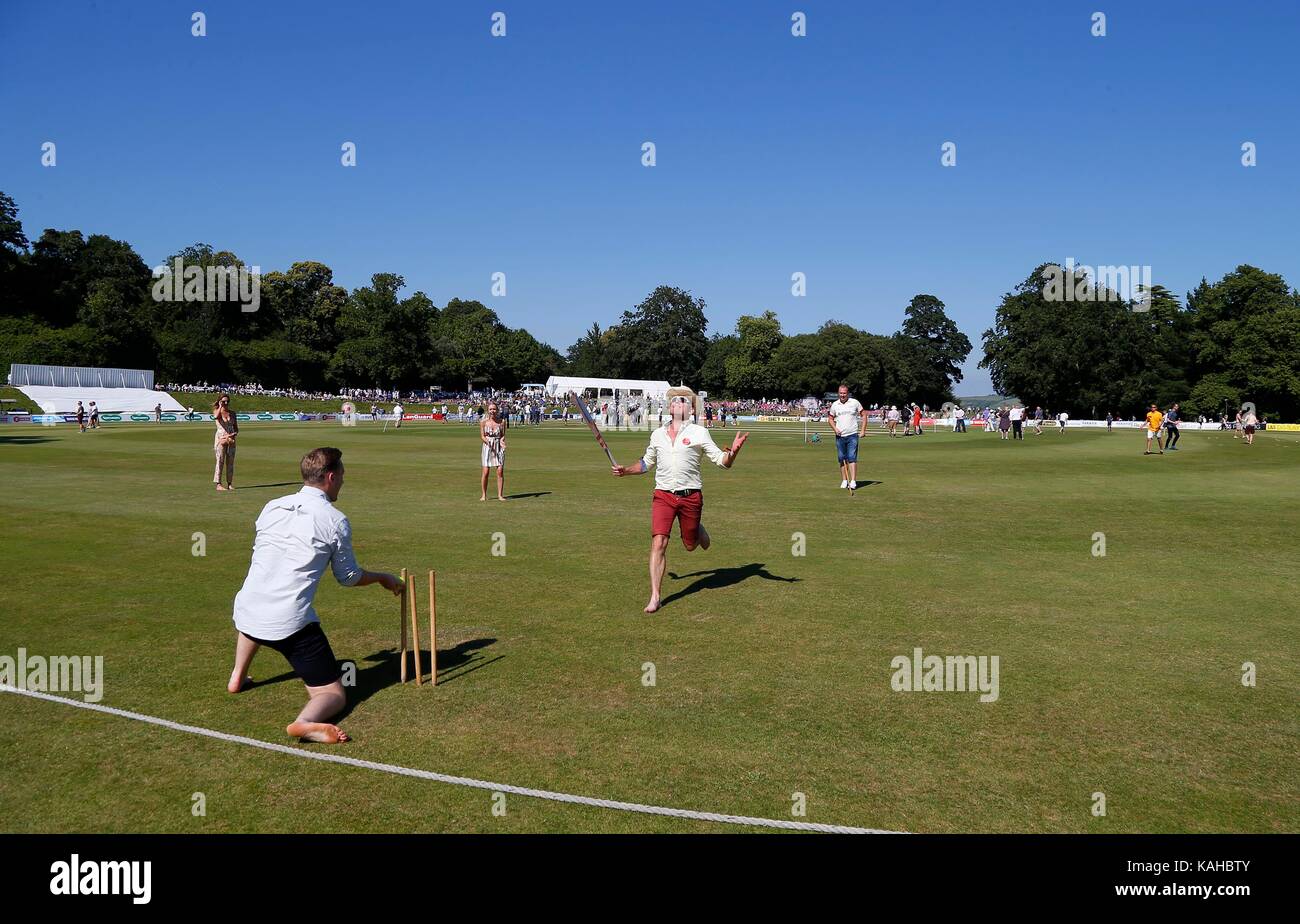 Cricket fans have a game of cricket on the outfield during a Sussex ...