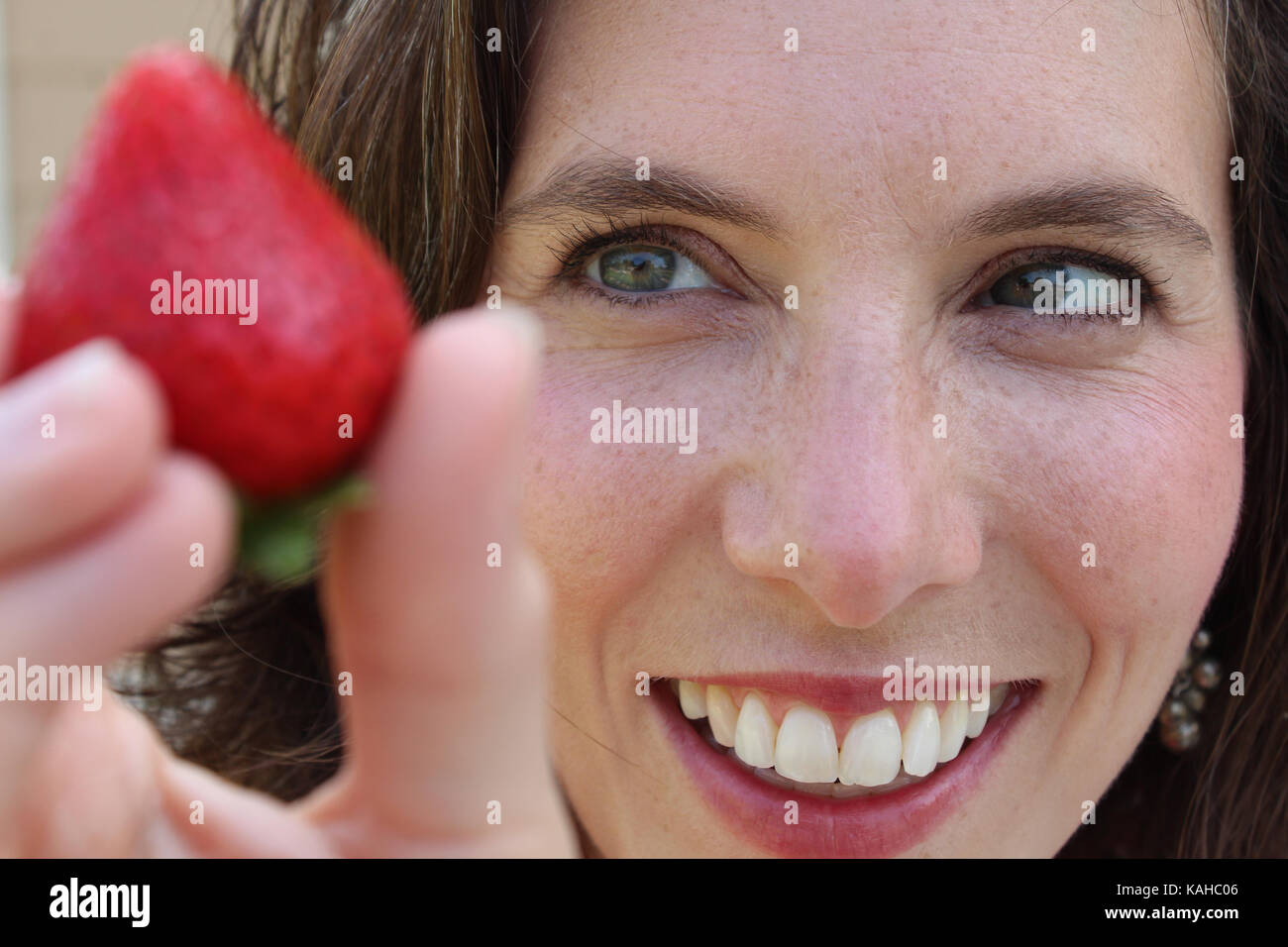 Woman with Strawberry Stock Photo - Alamy