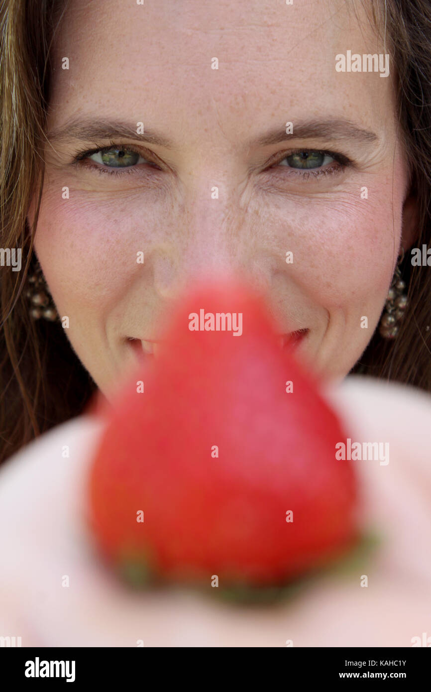 Woman with Strawberry Stock Photo - Alamy