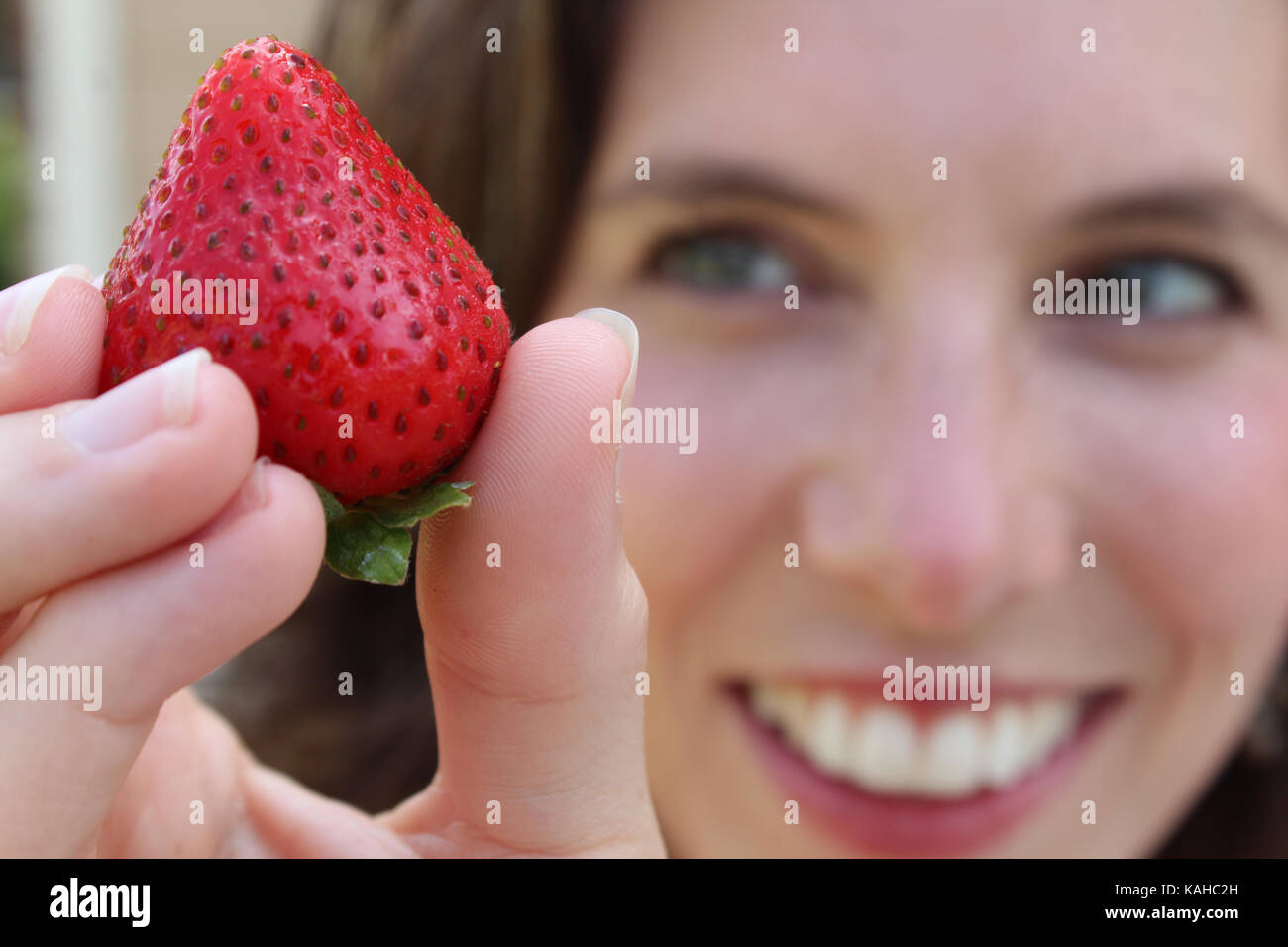 Woman with Strawberry Stock Photo - Alamy