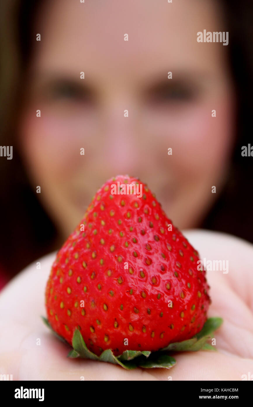 Woman with Strawberry Stock Photo - Alamy
