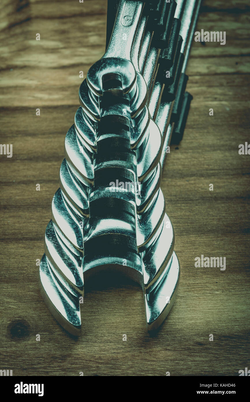 Close up of kit of wrenches in wooden workshop Stock Photo - Alamy