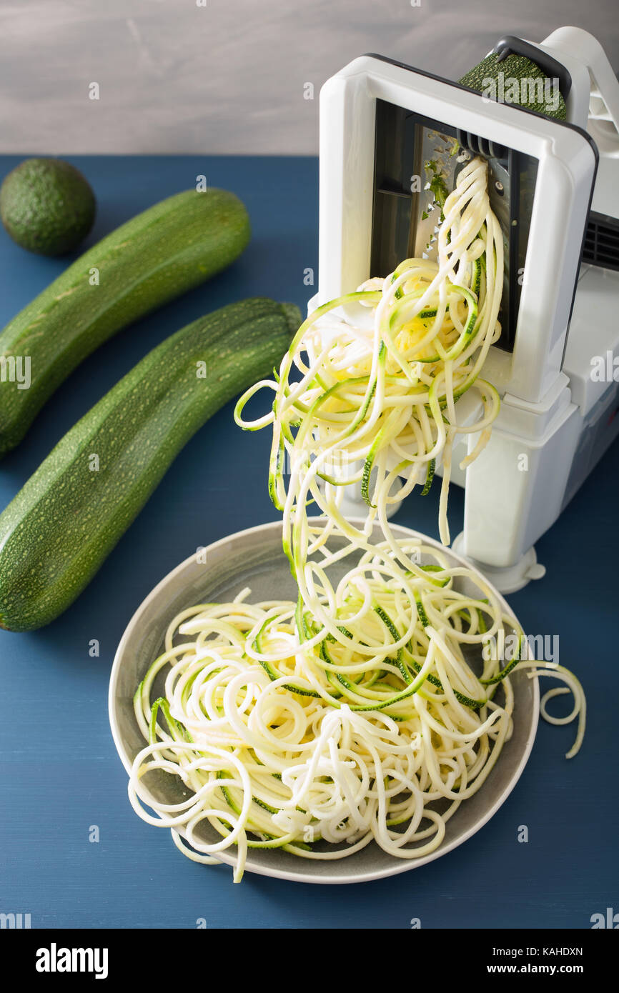spiralizing courgette raw vegetable with spiralizer Stock Photo - Alamy