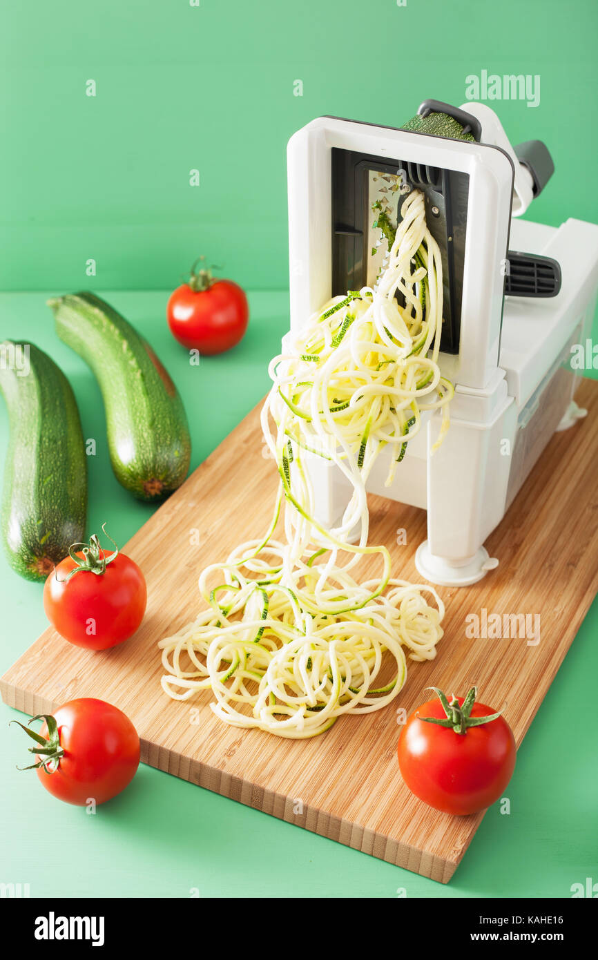 spiralizing courgette raw vegetable with spiralizer Stock Photo - Alamy