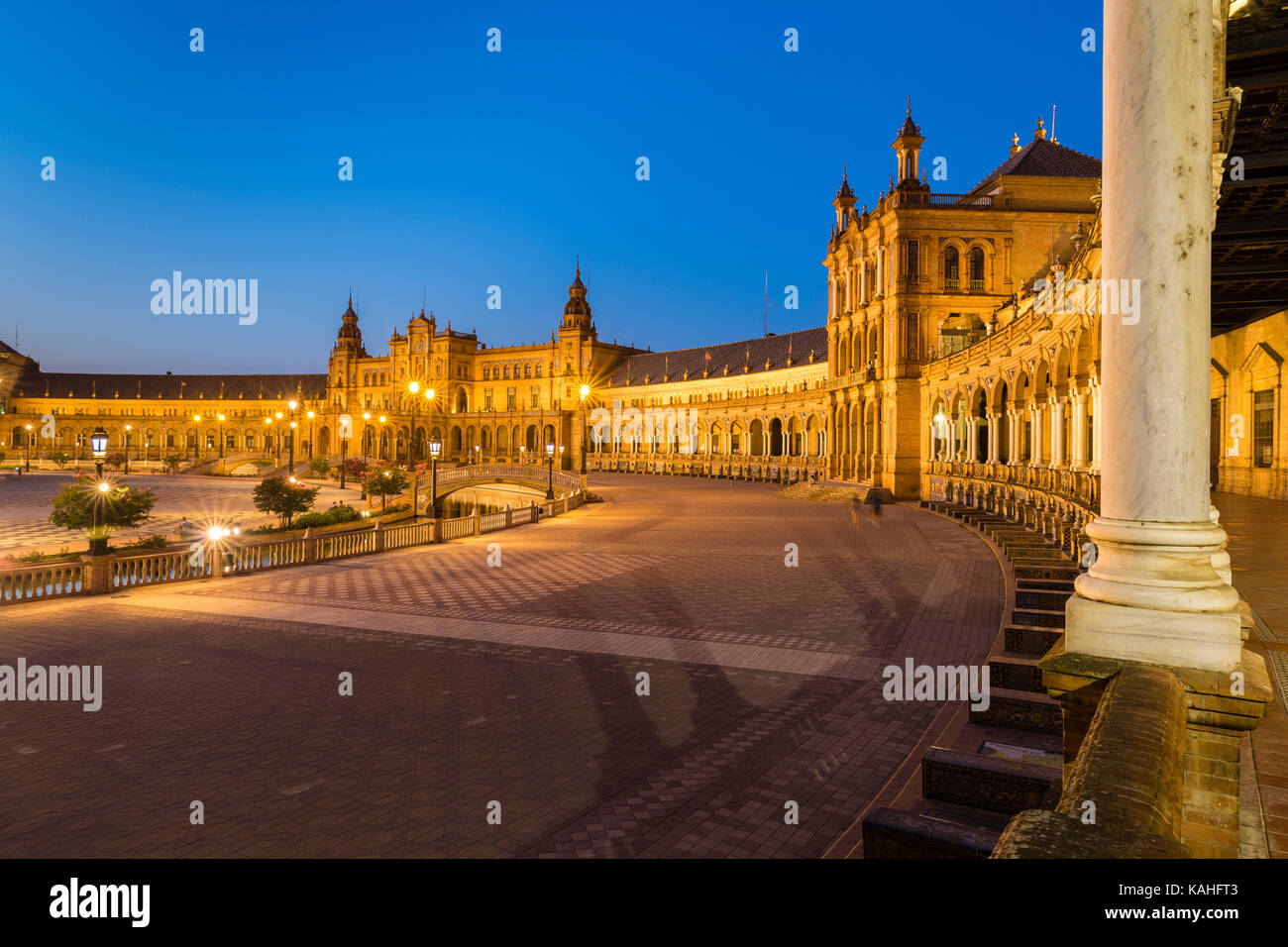Illuminated Plaza de España at dusk, Seville, Andalusia, Spain Stock ...
