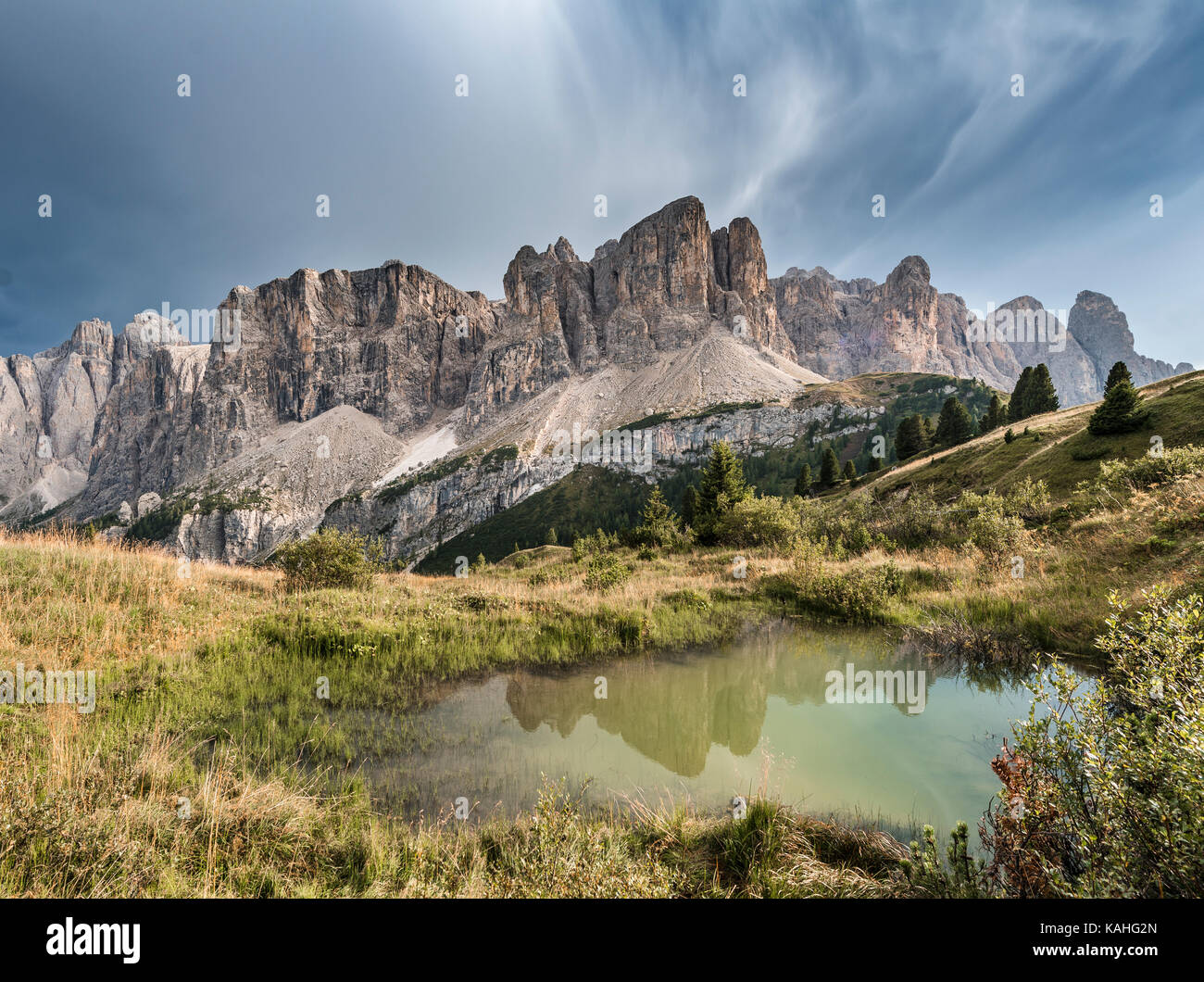 Sella Group with Piscadu reflected in a small pond, Gardena Pass, Passo ...
