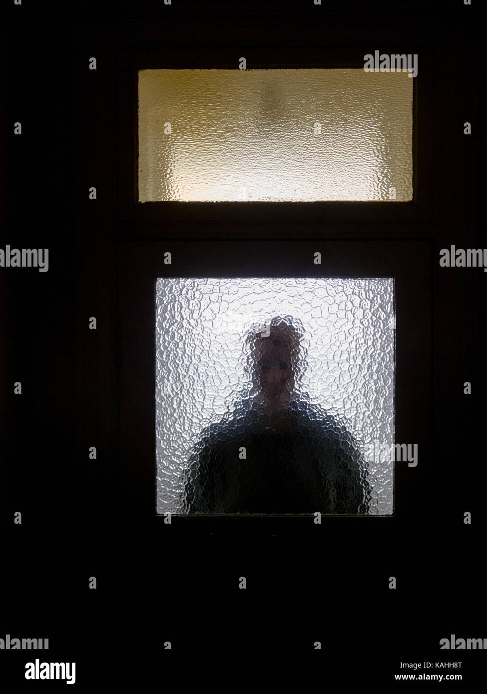 Shadow behind glass door hi-res stock photography and images - Alamy