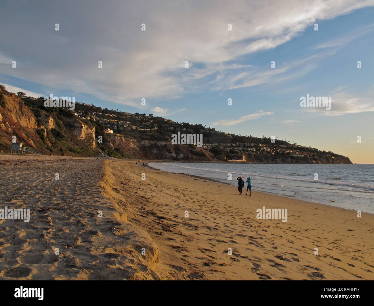 Pair Walking along the shore at Torrance Beach, Los Angeles, California ...
