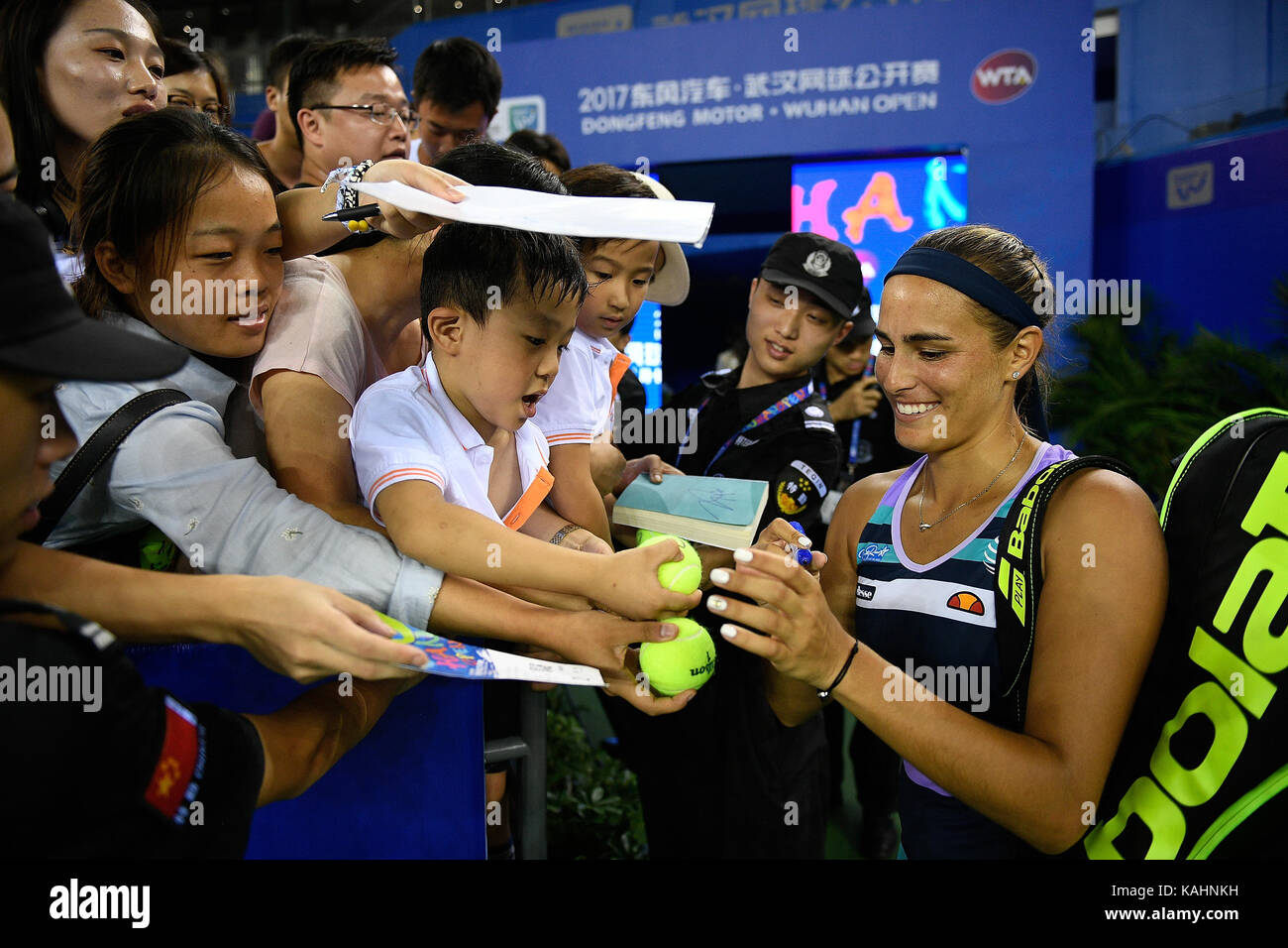 Wuhan, China. 26th Sep, 2017. Monica Puig of Puerto Rico signs her ...