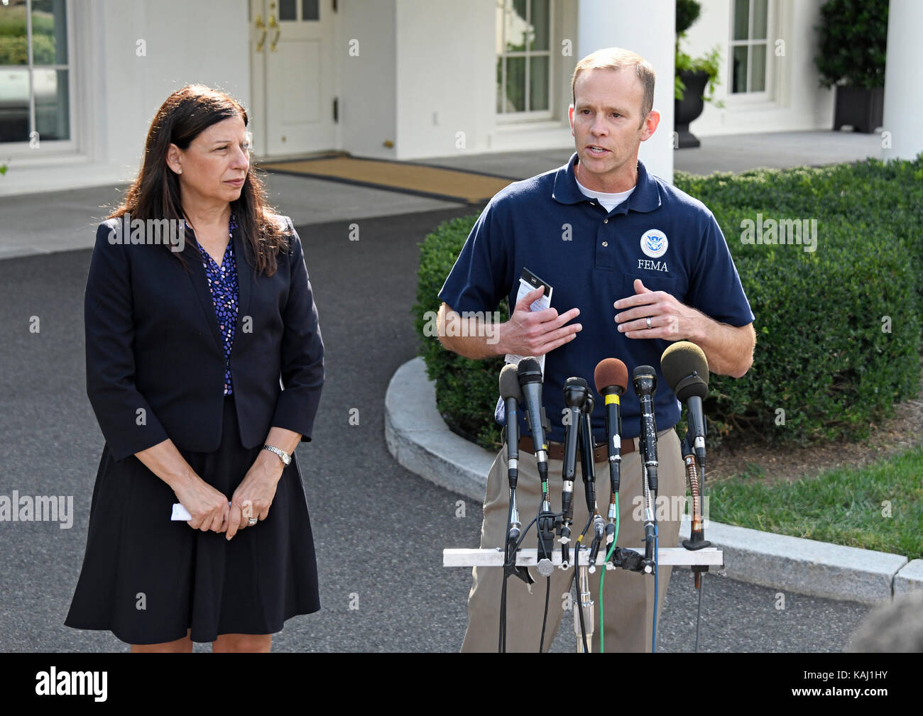 Acting Secretary of Homeland Security Elaine Duke, left, looks on as ...