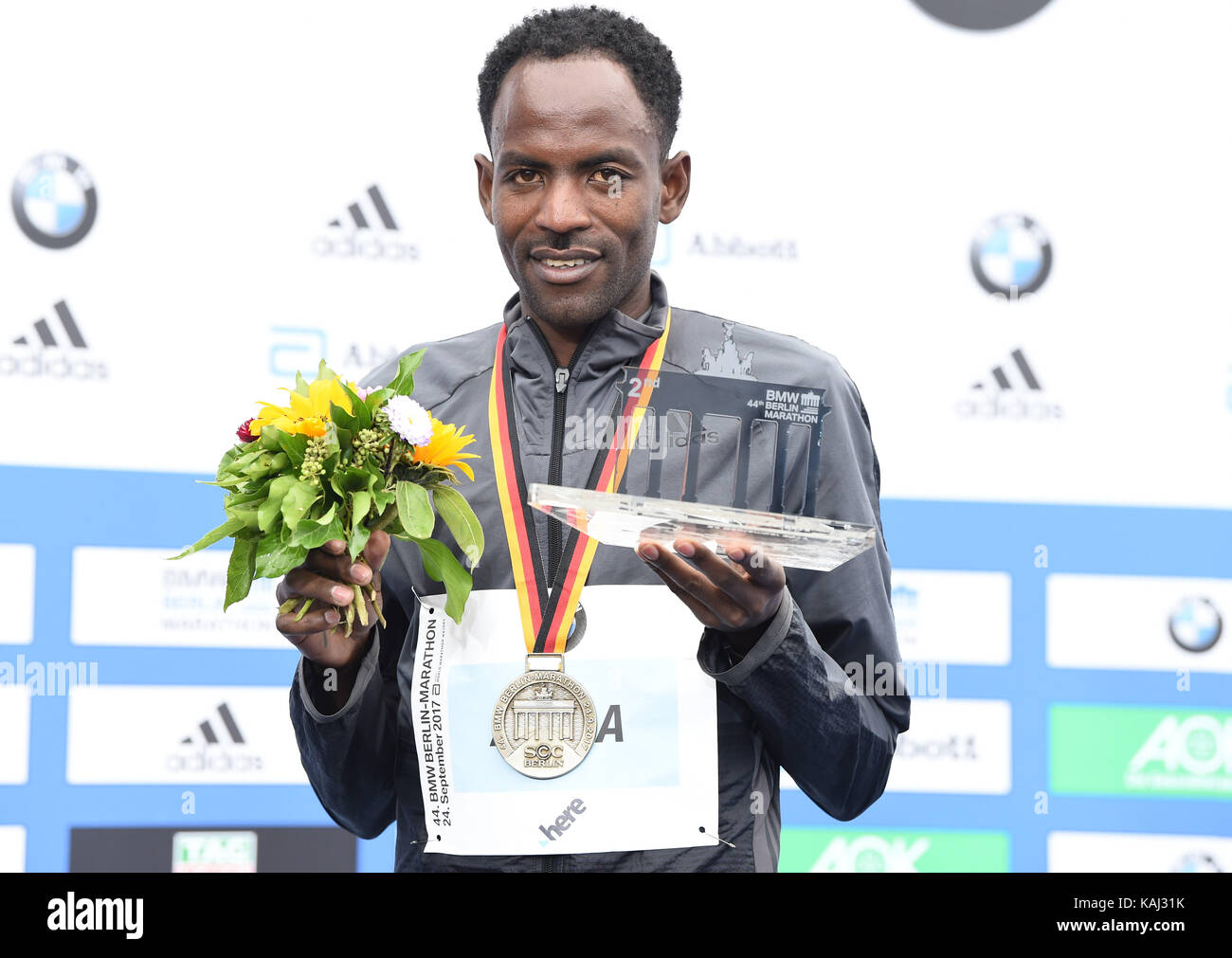 Berlin, Germany. 24th Sep, 2017. Guye Adola (ETH) poses after placing ...