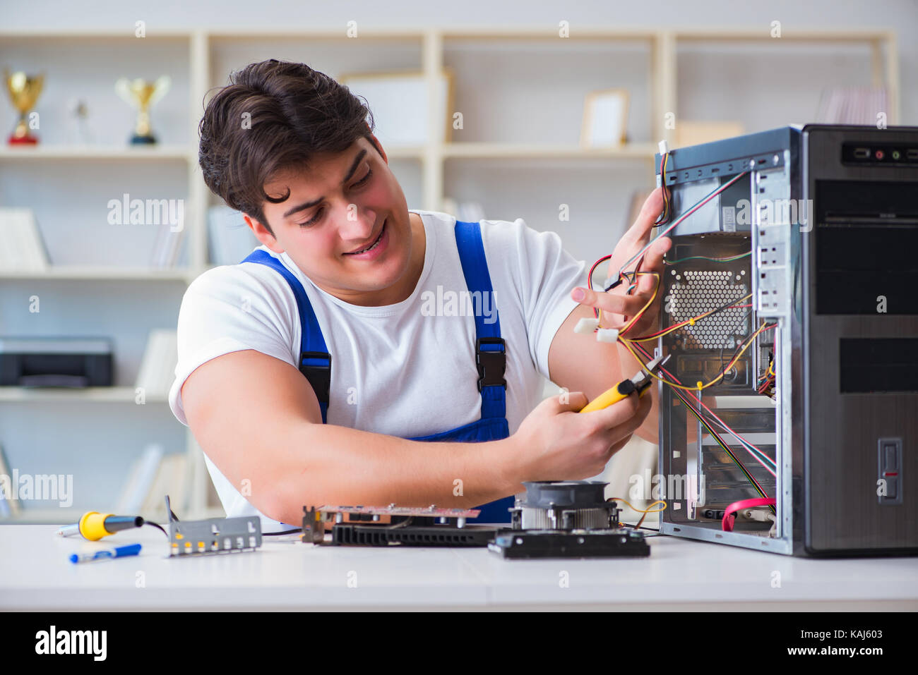 Computer repairman repairing desktop computer Stock Photo - Alamy