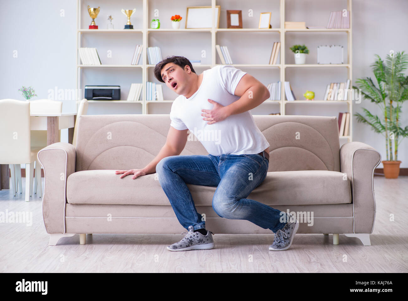 Man suffering from sick stomach and vomiting Stock Photo - Alamy