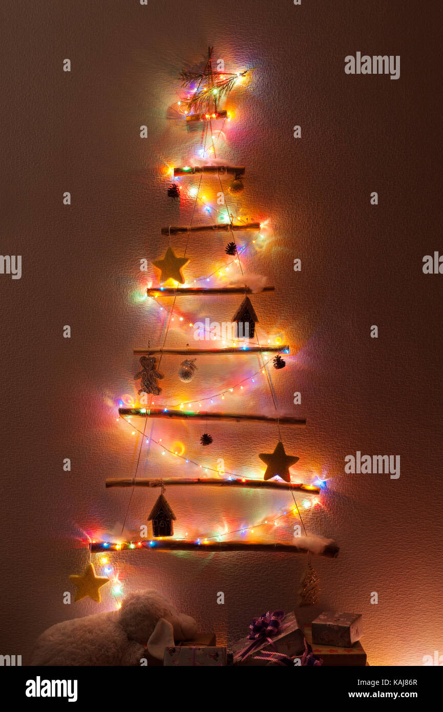 Handmade Christmas tree hanging on the wall in the living room Stock ...