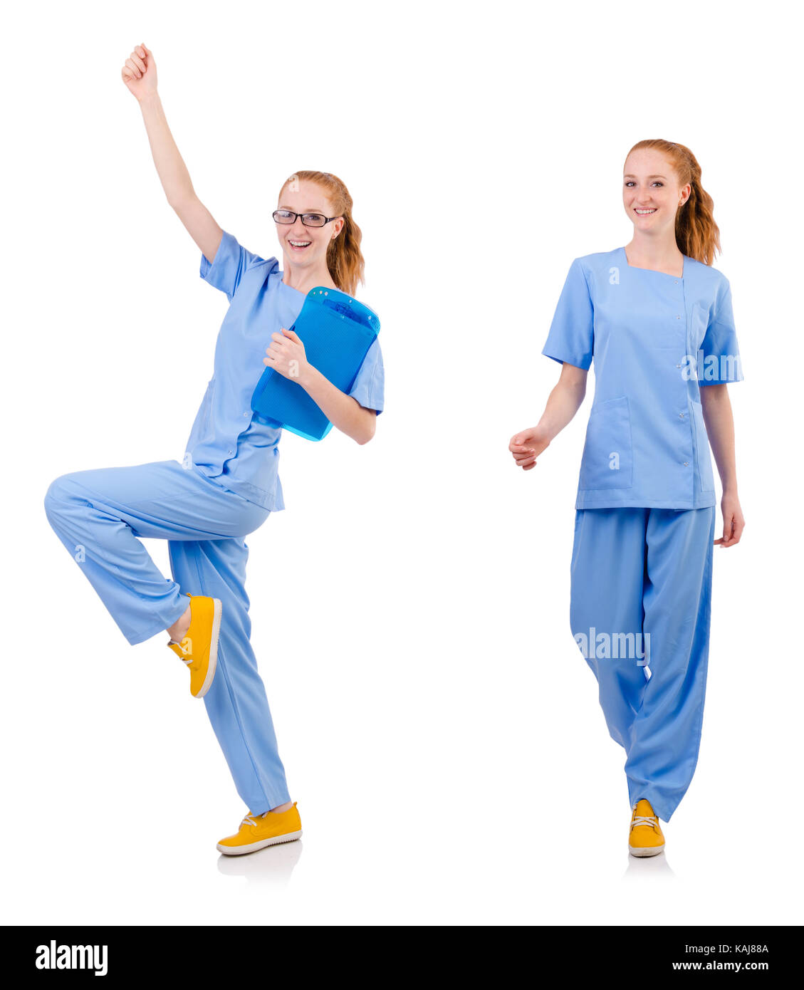 Pretty dancing doctor in blue uniform with documents isolated on white ...