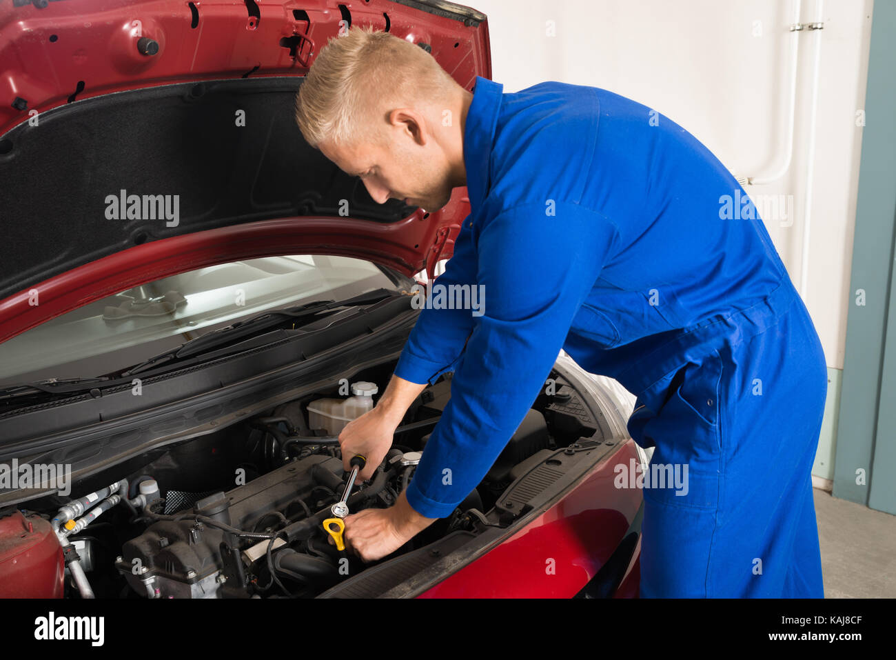 Worker using screwdriver in hi-res stock photography and images - Alamy