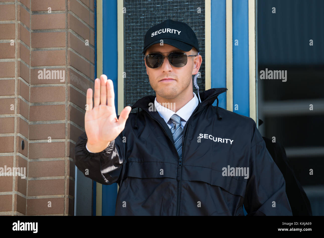 Close-up Of A Male Security Guard Making Stop Sign With Hand Wearing ...