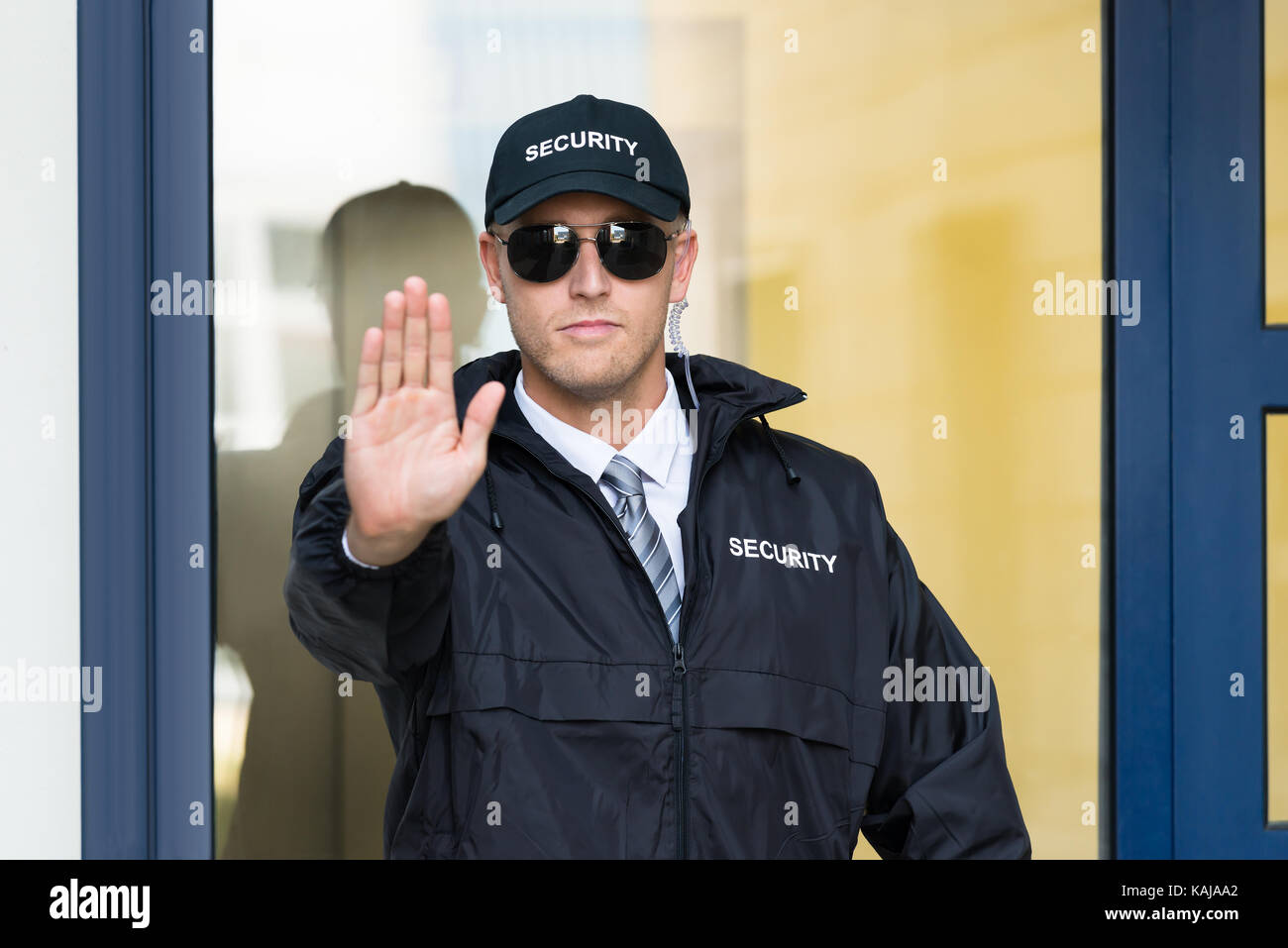 Close-up Of A Male Security Guard Making Stop Sign With Hand Wearing ...