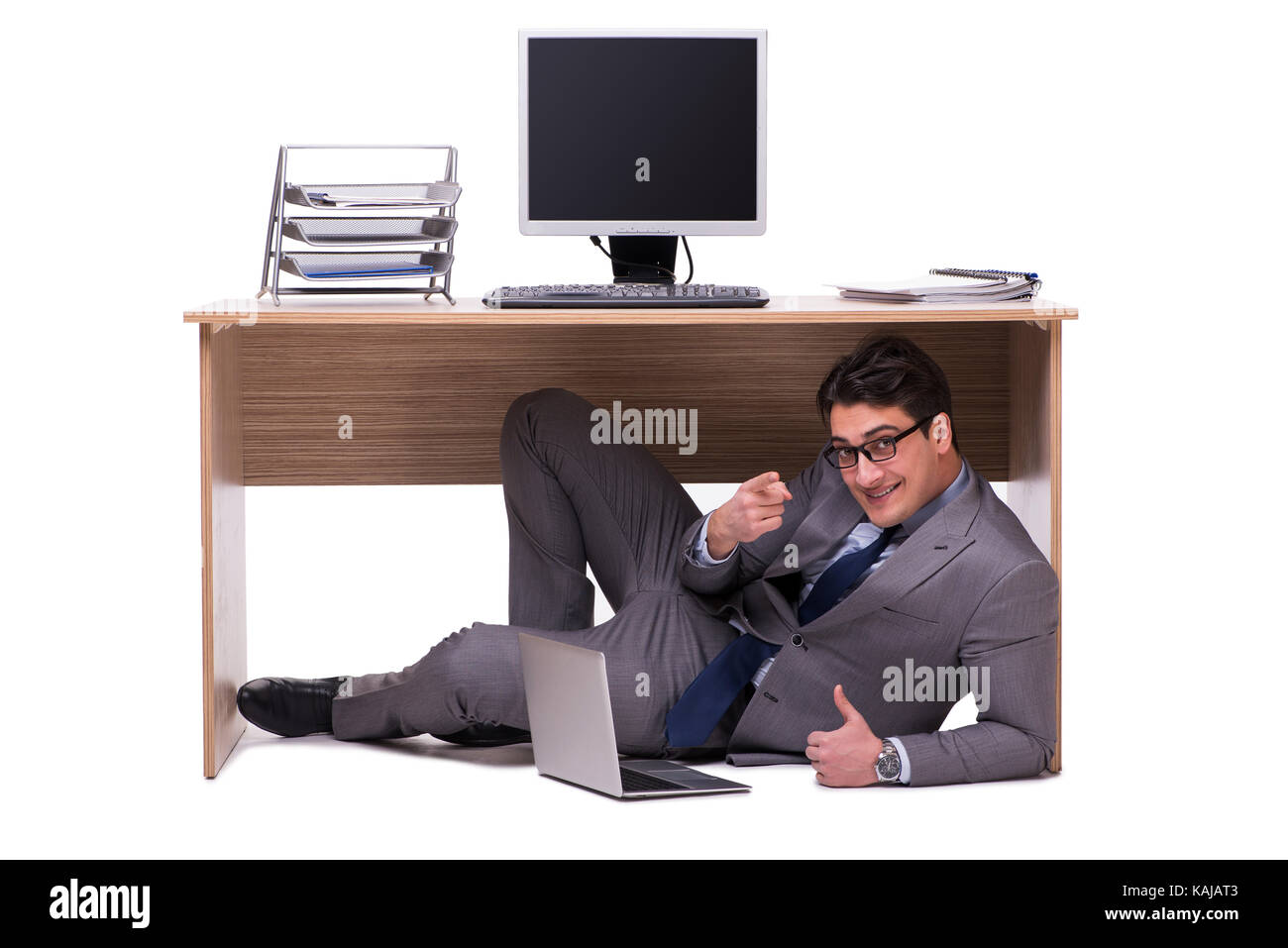 Businessman hiding in the ofice Stock Photo - Alamy