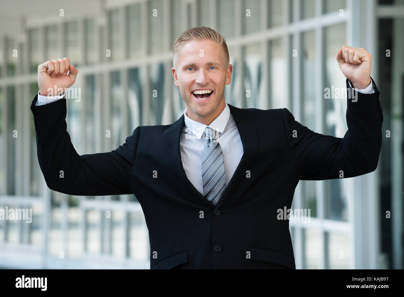 Excited businessman screaming raising hands hi-res stock photography ...
