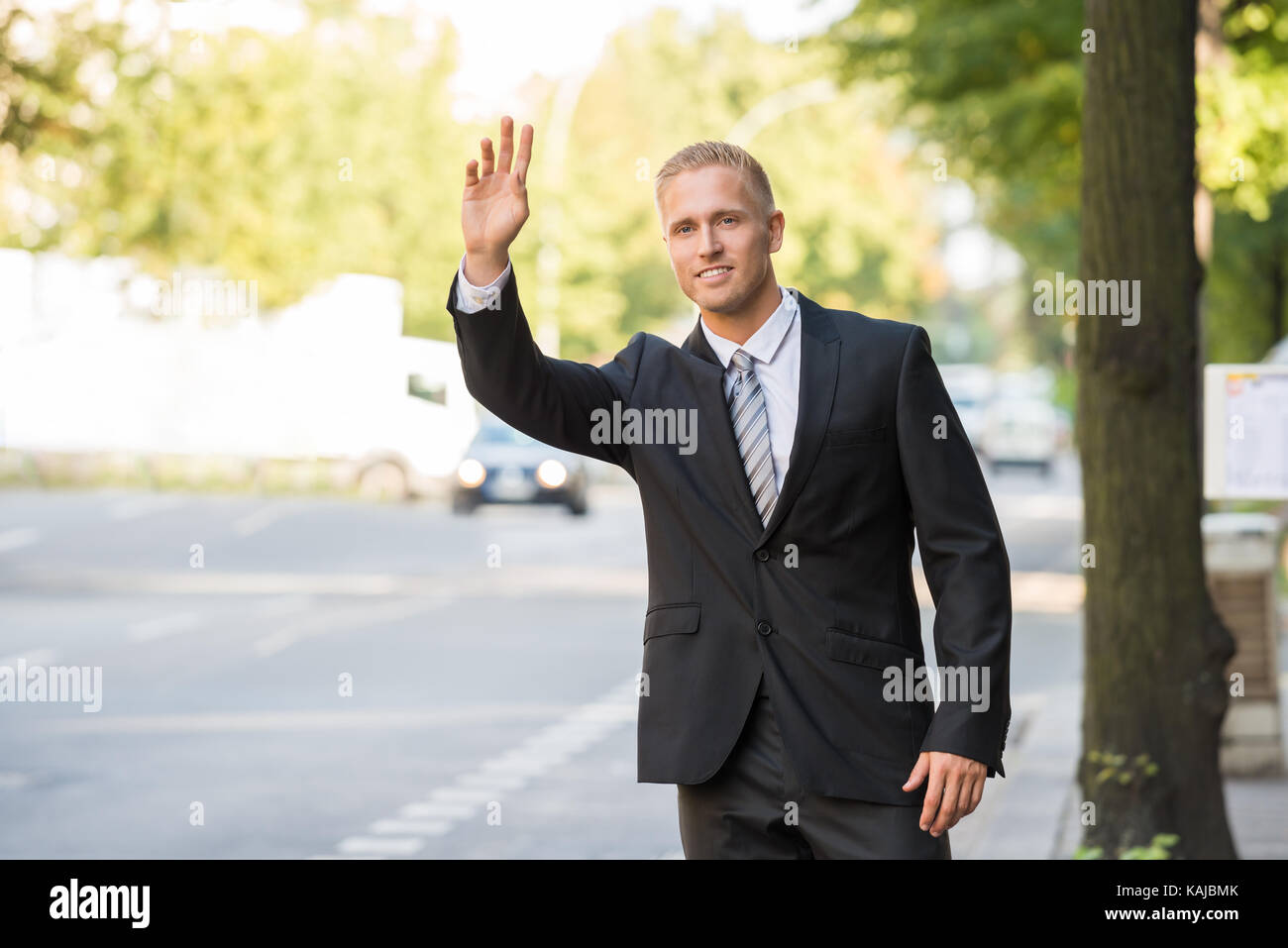 Businessman waiting for cab hi-res stock photography and images - Alamy