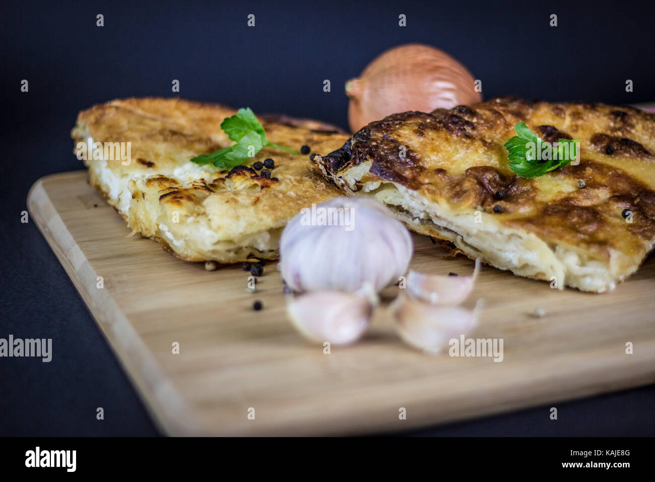 Cheese burek composition on dark background Stock Photo - Alamy