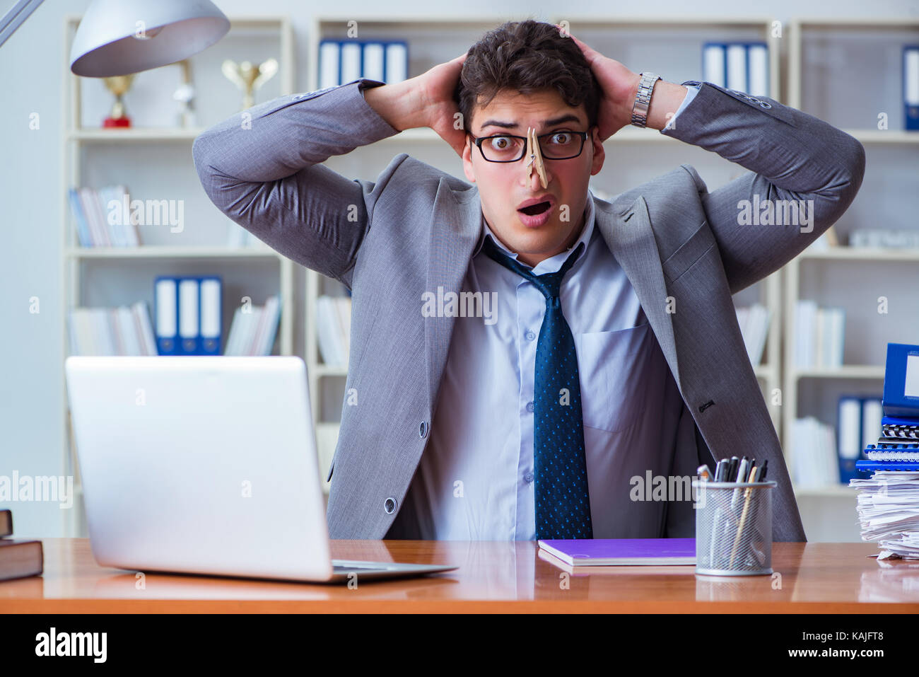 Businessman sweating excessively smelling bad in office at workplace ...