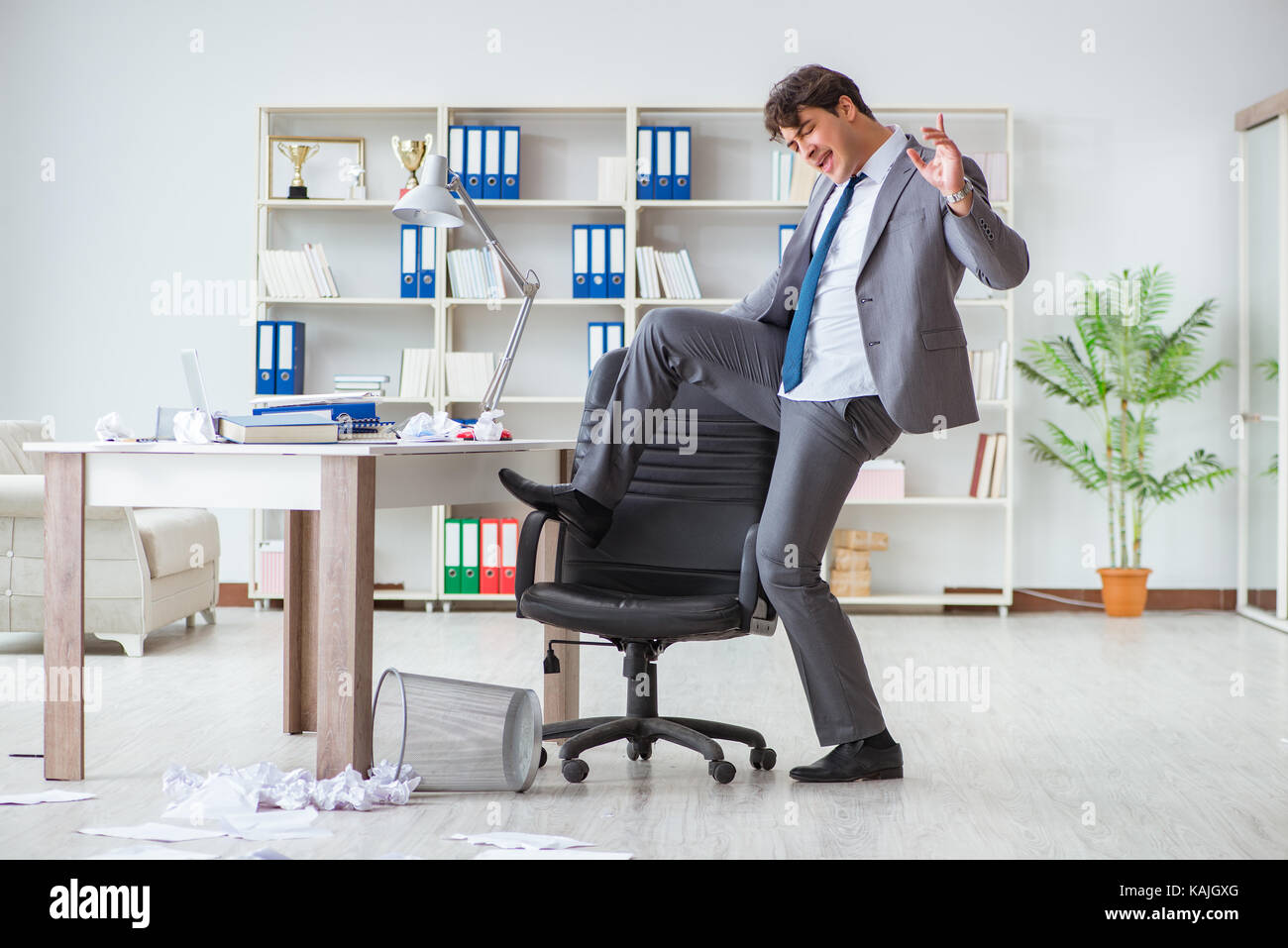 Businessman having fun taking a break in the office at work Stock Photo ...