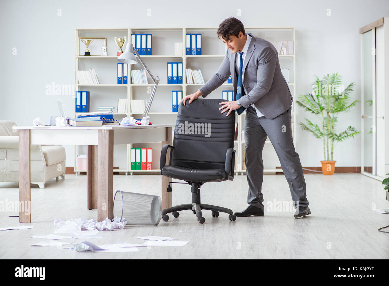 Businessman having fun taking a break in the office at work Stock Photo ...