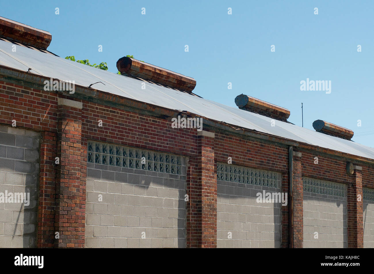 Brick built building with blue sky Stock Photo - Alamy