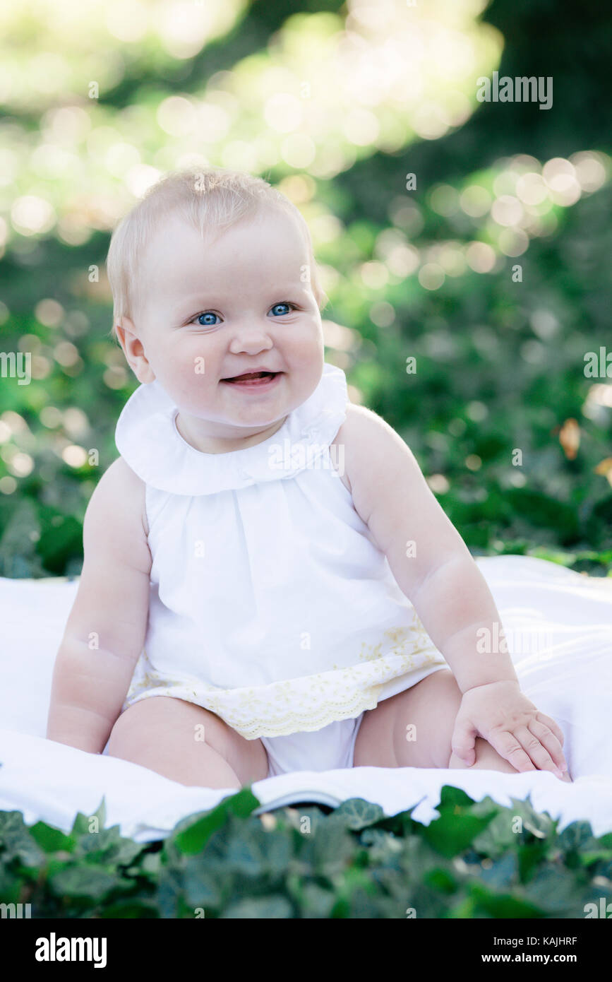 baby girl 8 months old portrait outdoors in sunlight Stock Photo - Alamy