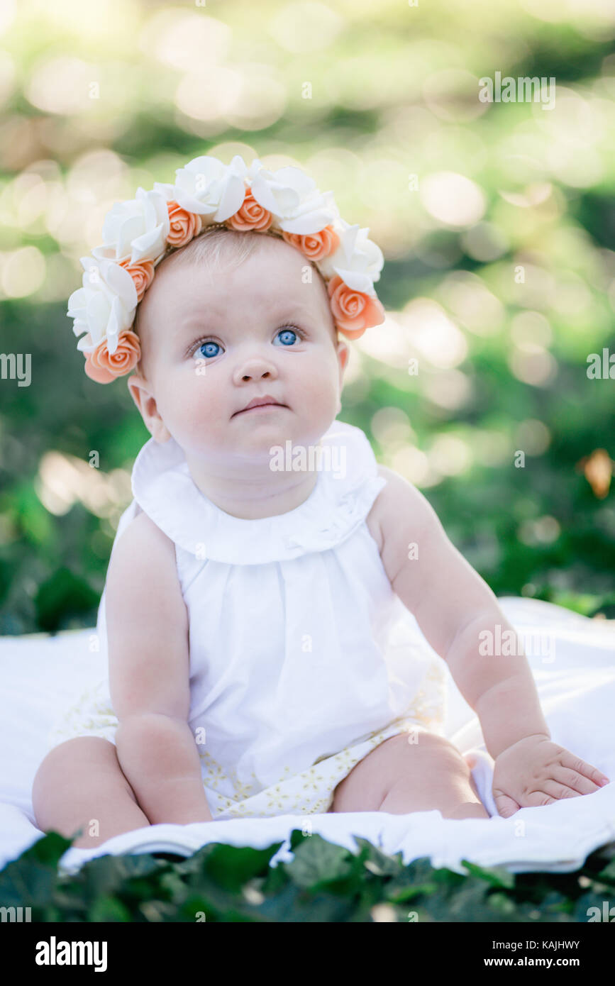 baby girl 8 months old portrait outdoors in sunlight Stock Photo - Alamy