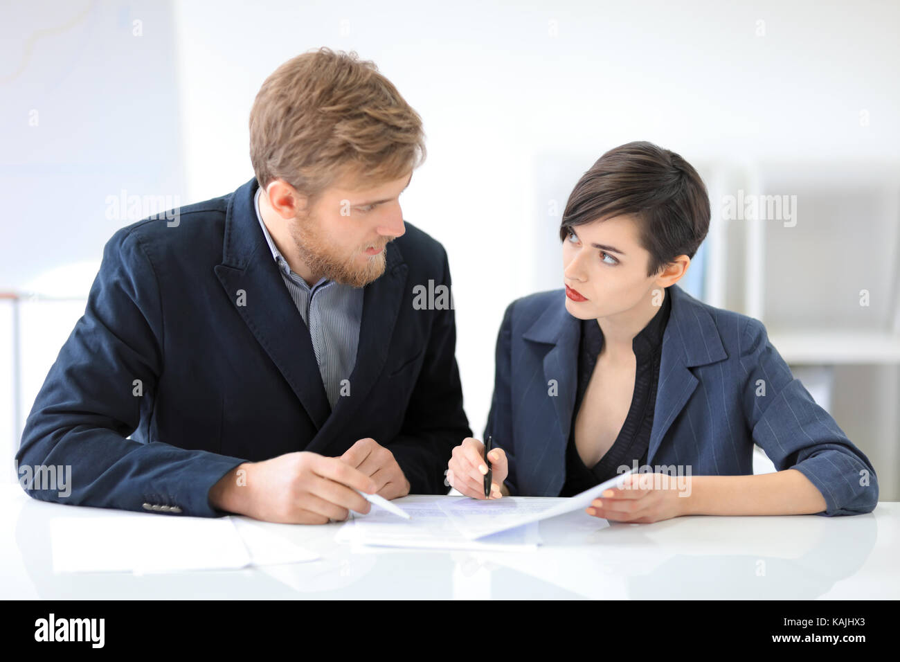 Business people signing a contract in the office Stock Photo - Alamy