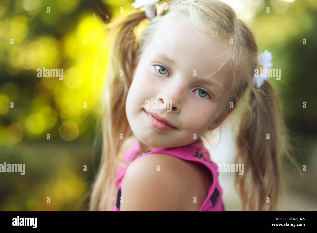 Portrait of the beautiful blonde little girl on nature Stock Photo - Alamy