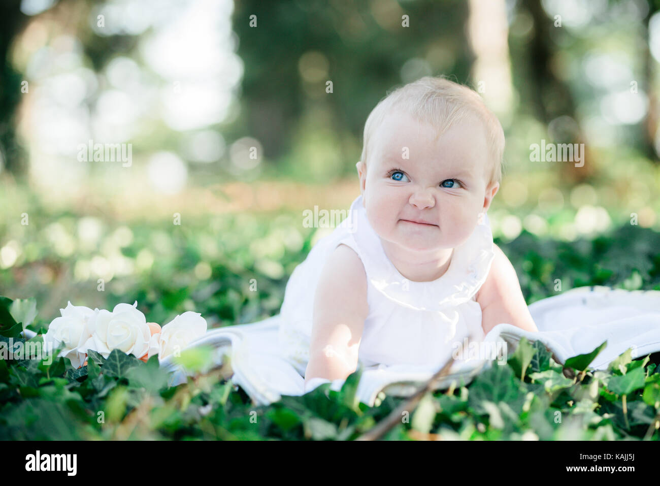 baby girl 8 months old portrait outdoors in sunlight Stock Photo - Alamy