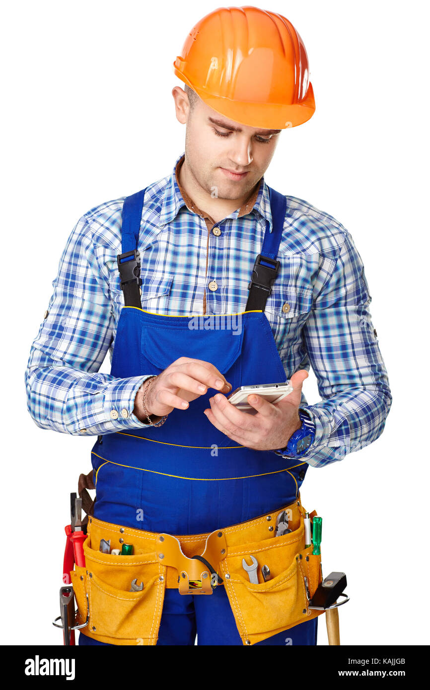 Portrait of young male construction worker with smartphone wearing ...