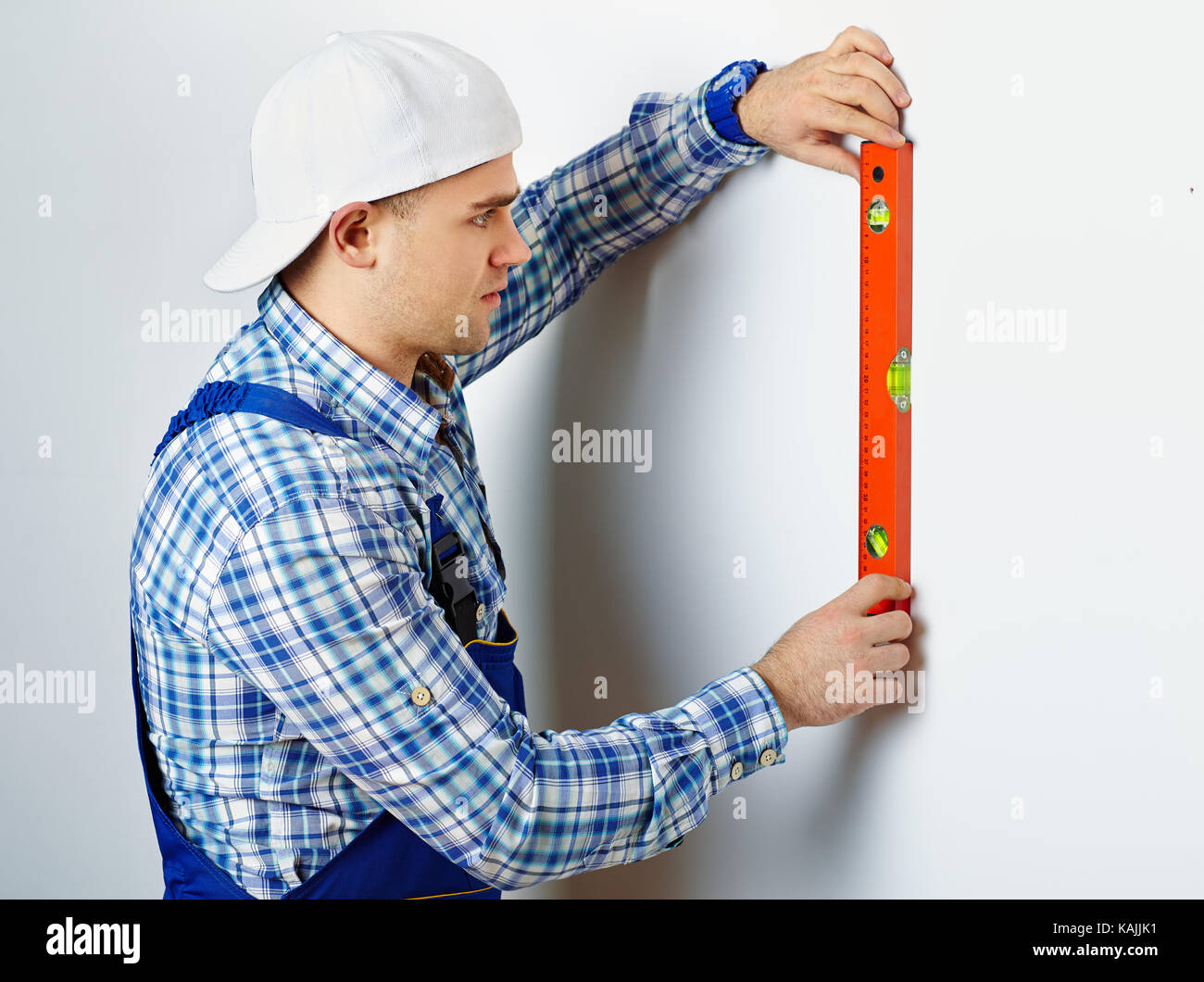 Young handyman spirit level hi-res stock photography and images - Alamy