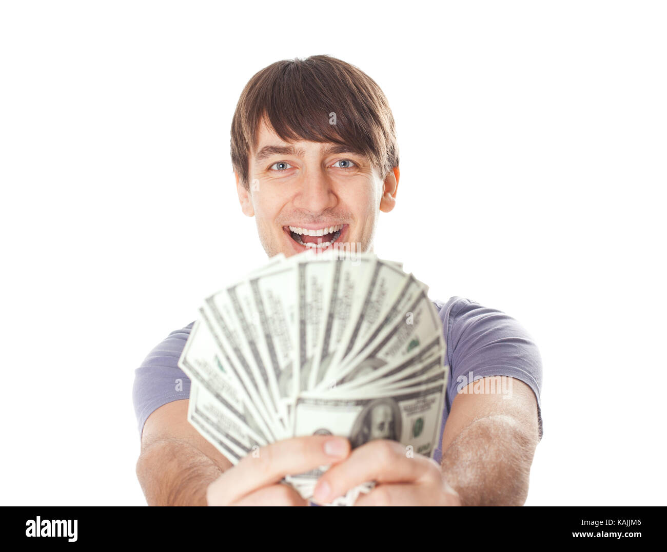 Portrait of a young smiling man holding a dollar bills isolated on ...