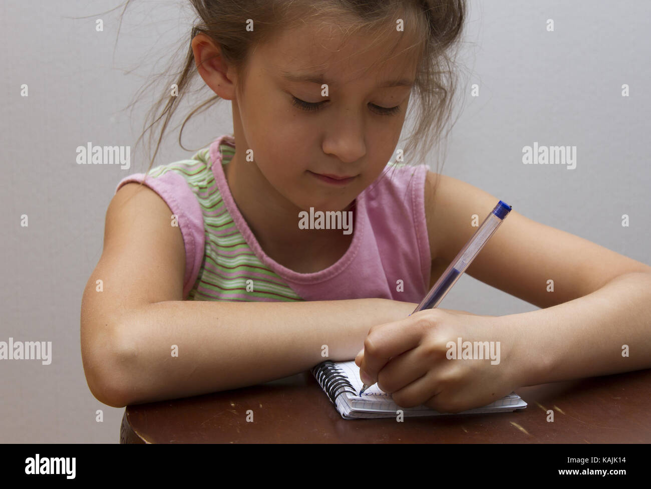 young female teenager writing or drawing on notebook Stock Photo - Alamy