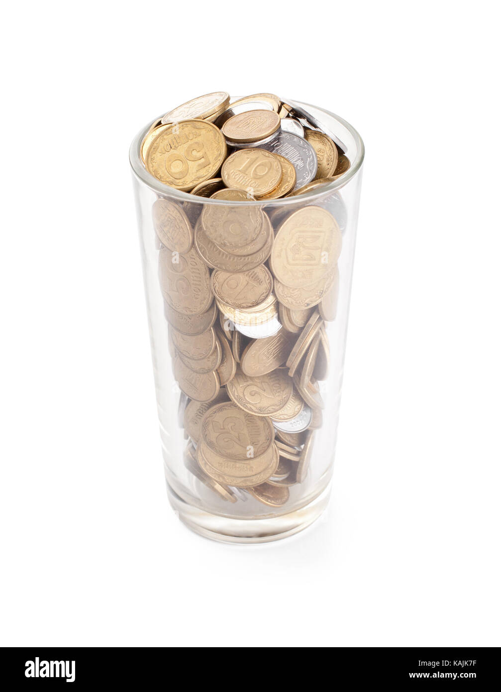 Coins in a glass cup isolated on white background Stock Photo - Alamy