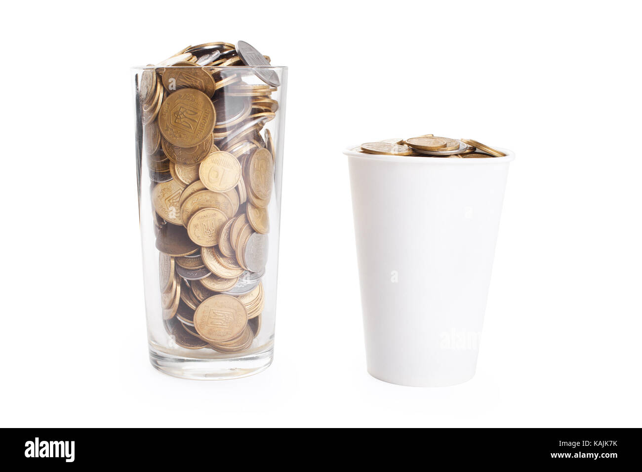Coins in glass cup and white cup isolated on white background Stock ...