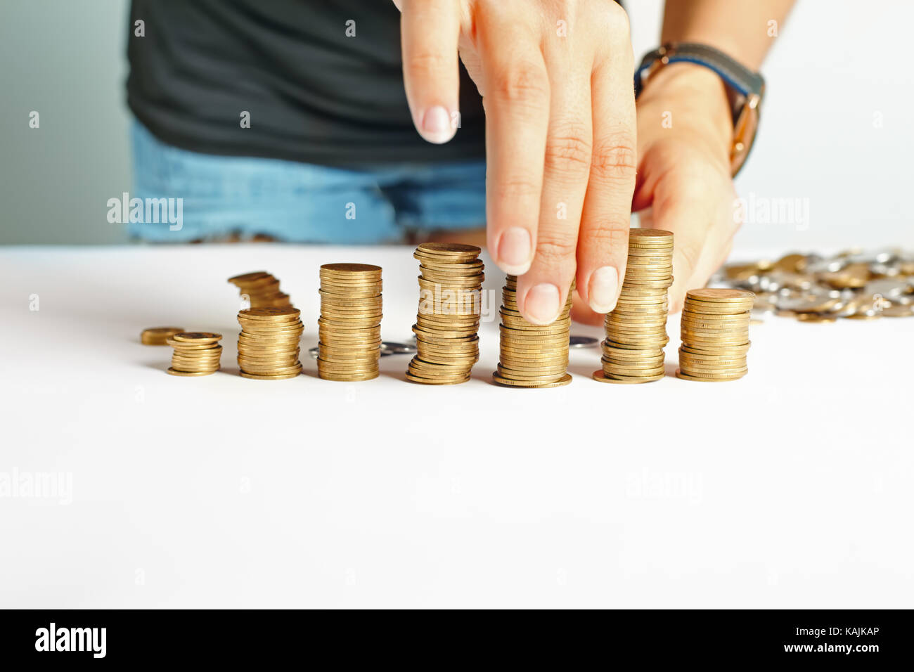Girl put coins to stack of coins ,Business idea, Savings Stock Photo ...