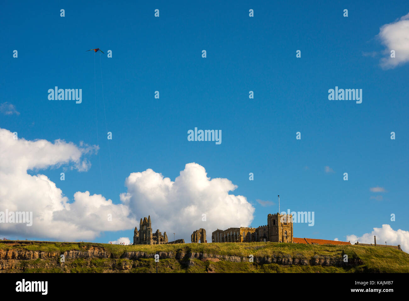 Whitby Abbey & St Mary's Church, cliff top view with blue sky and kite ...