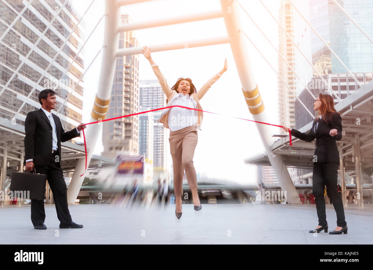 Running businesswoman crossing finish line win success Stock Photo - Alamy