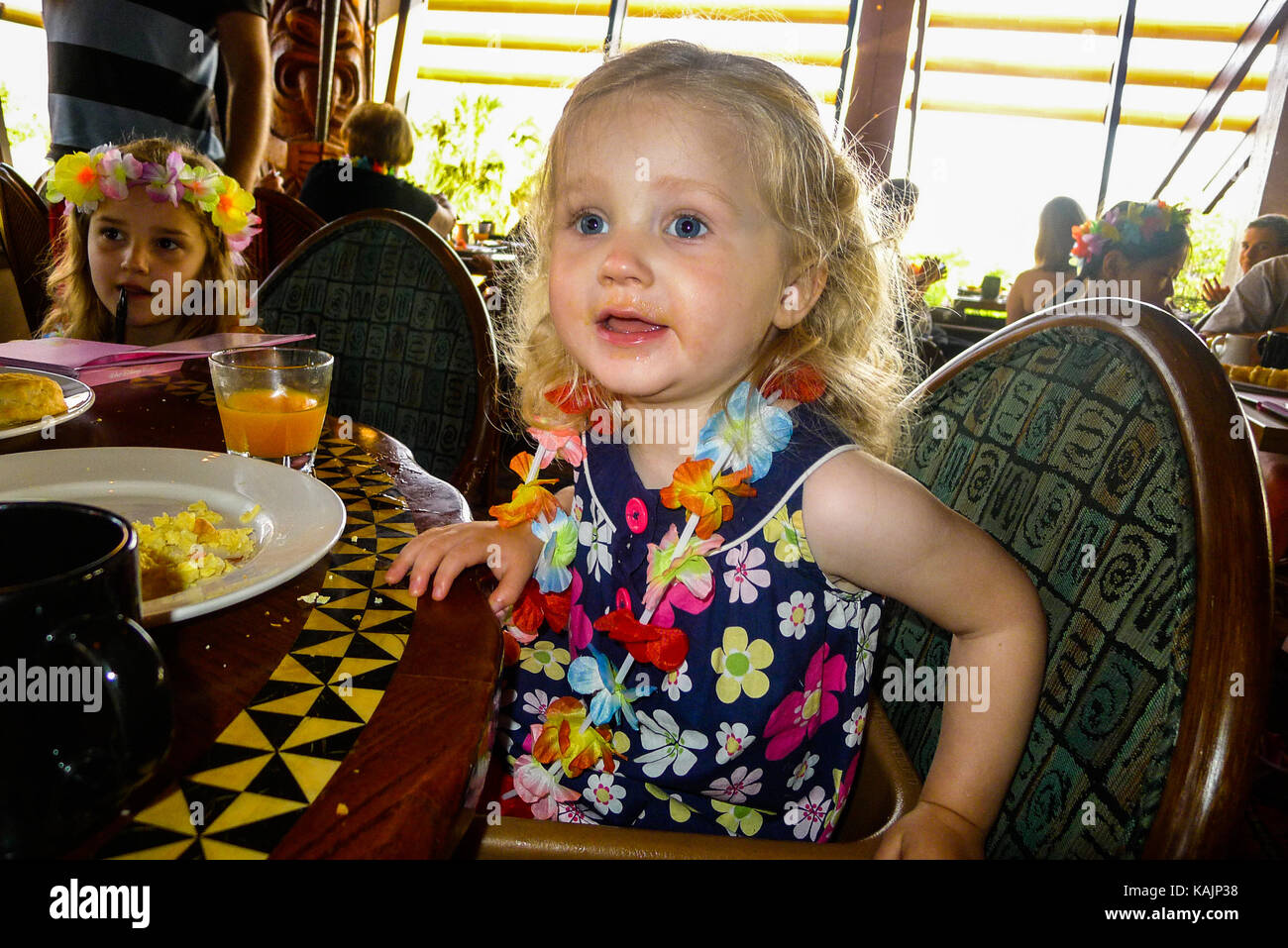 Child with an excited look on her face on seeing Mickey Mouse in Disney ...