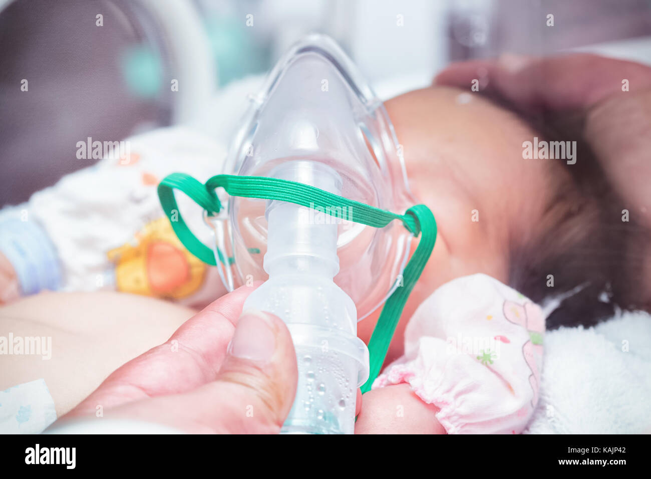 Nebulizer to a new born baby in hospital Stock Photo - Alamy