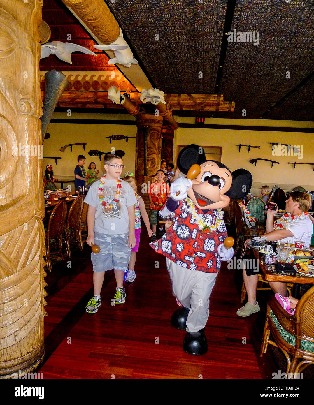 Mickey Mouse dancing around the room during a parade during a meet and ...